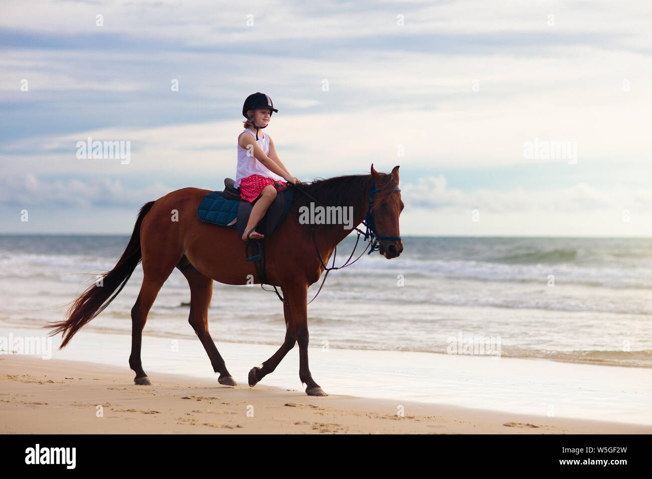 Child horse riding helmet sand hi-res stock photography and images - Alamy
