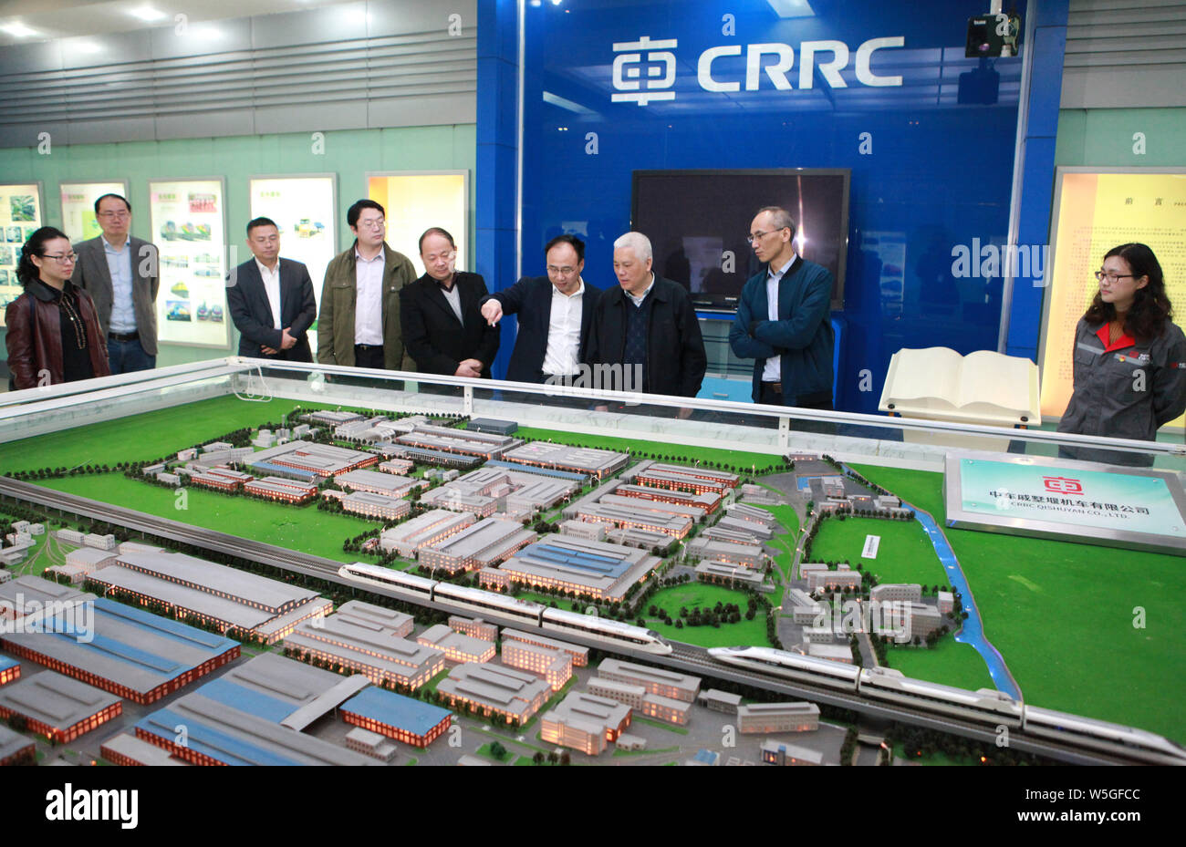 Officials view the model trains at a plant of CRRC (China Railway ...