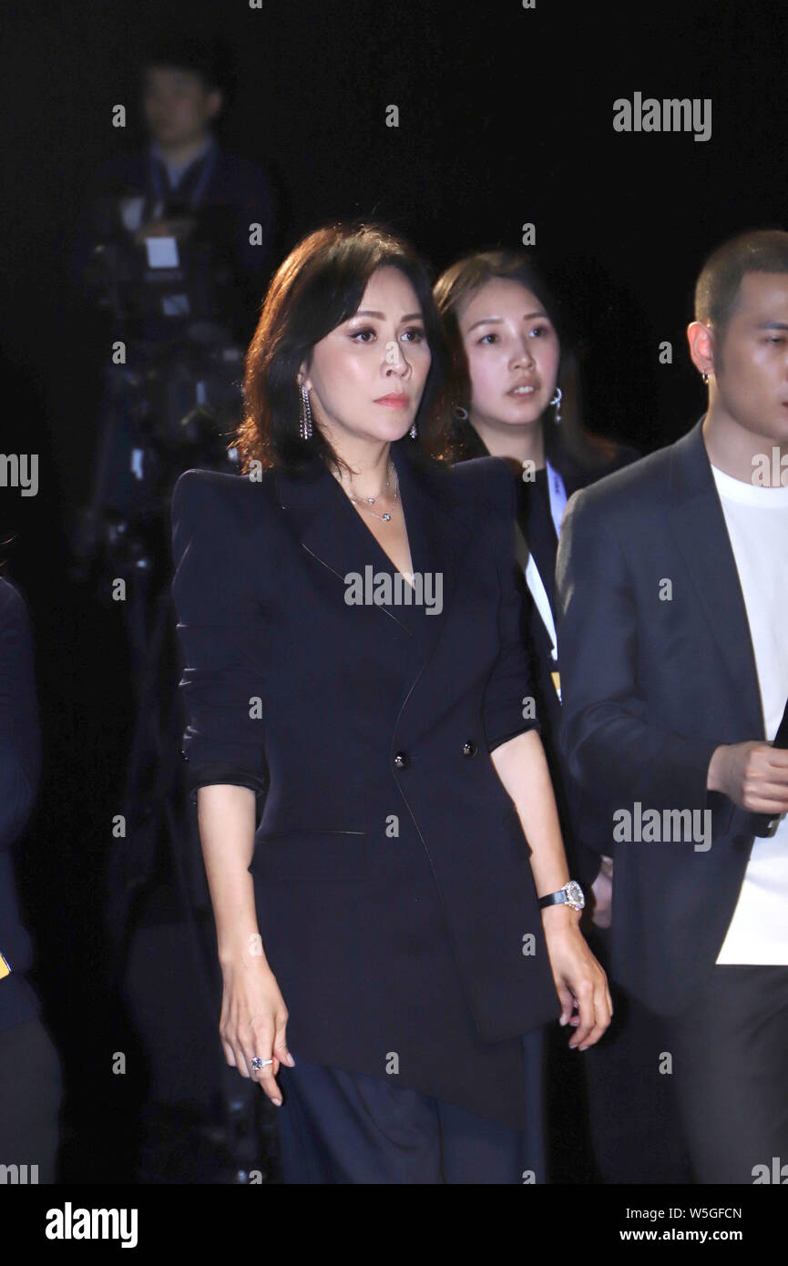 Hong Kong actress Carina Lau watches models displaying new creations at the Anirac show during ...