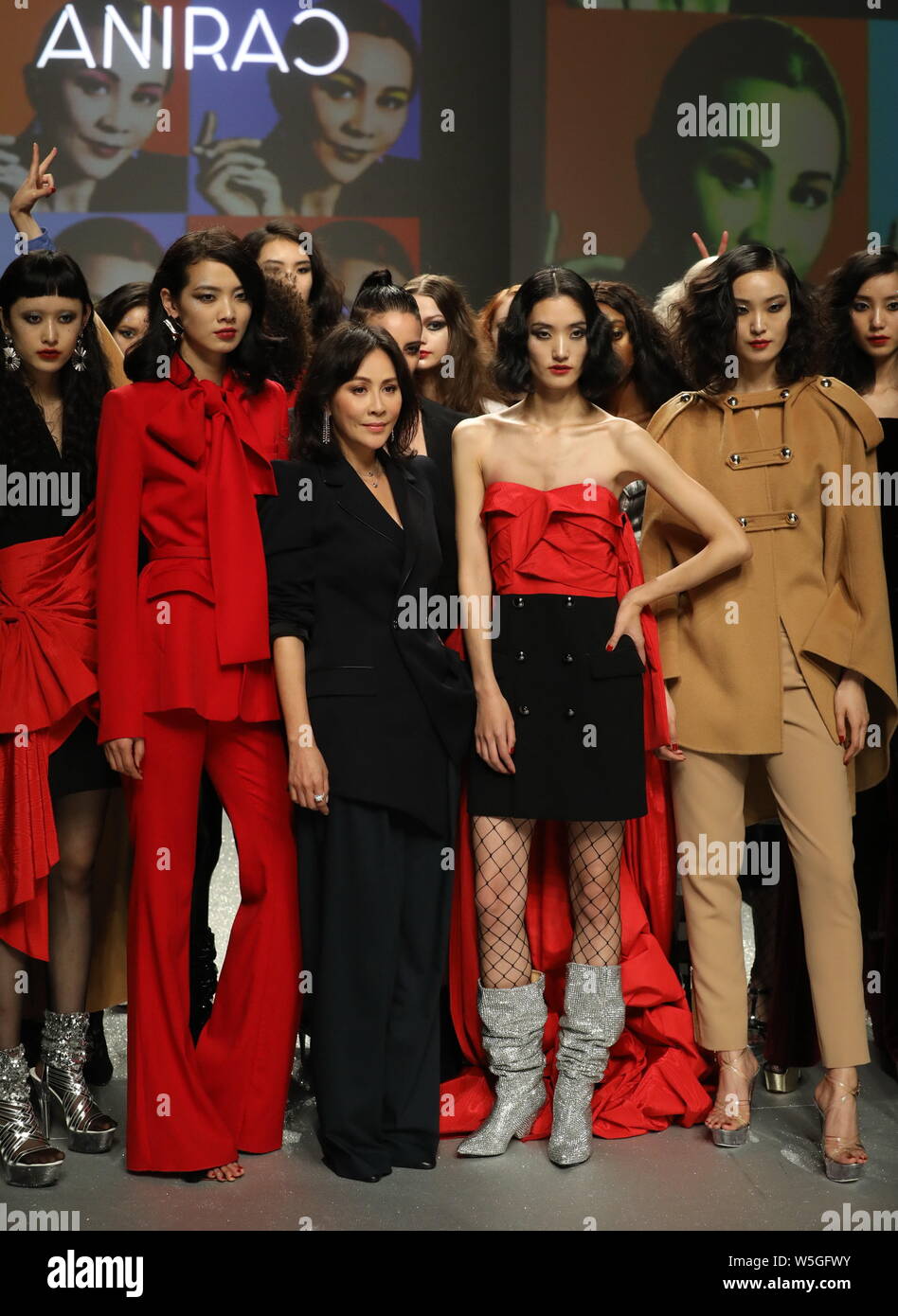 Hong Kong actress Carina Lau and models pose at the Anirac show during the Shanghai Fashion Week ...