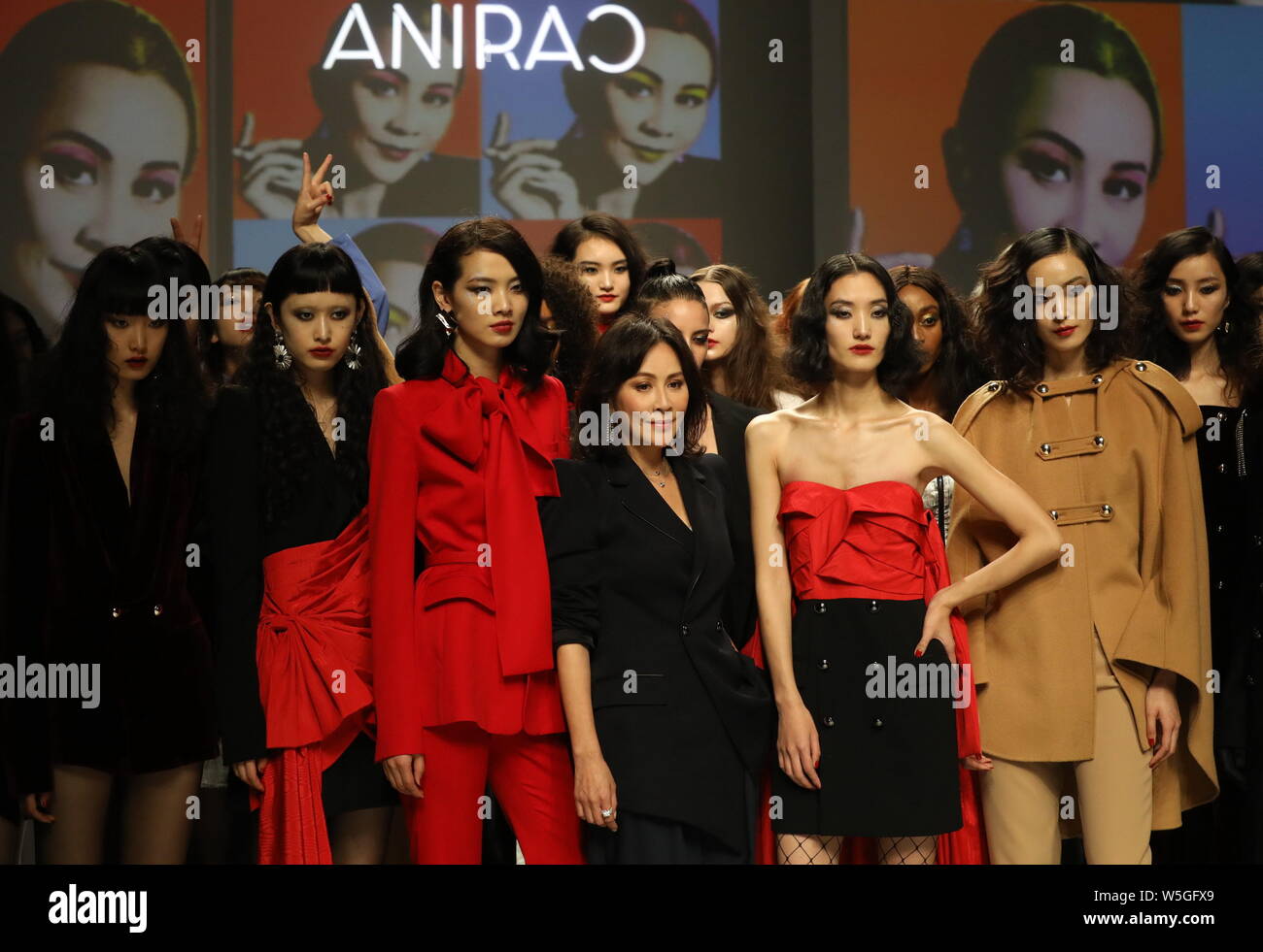 Hong Kong actress Carina Lau and models pose at the Anirac show during the Shanghai Fashion Week ...