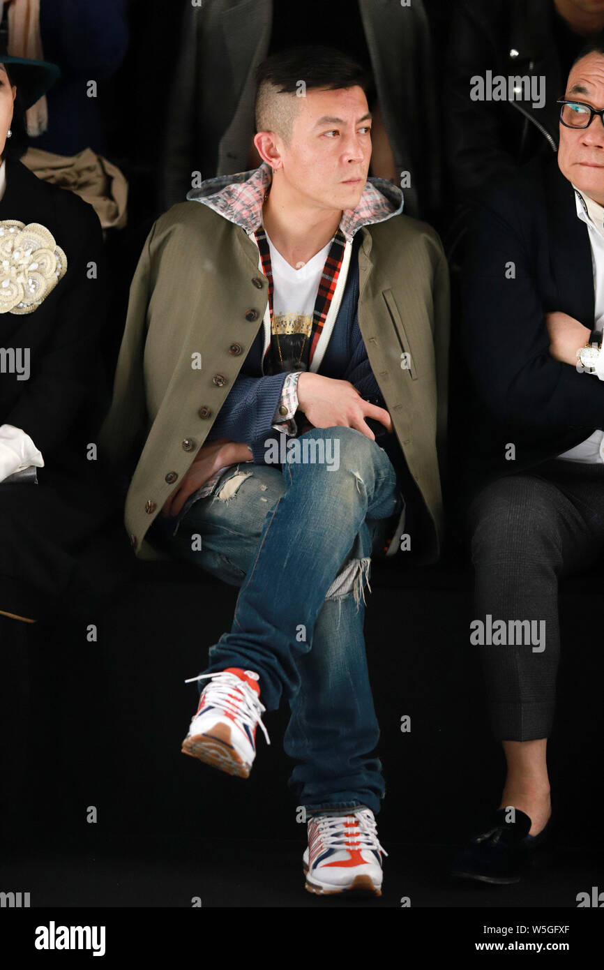 Hong Kong-Canadian actor and rapper Edison Chen watches models ...