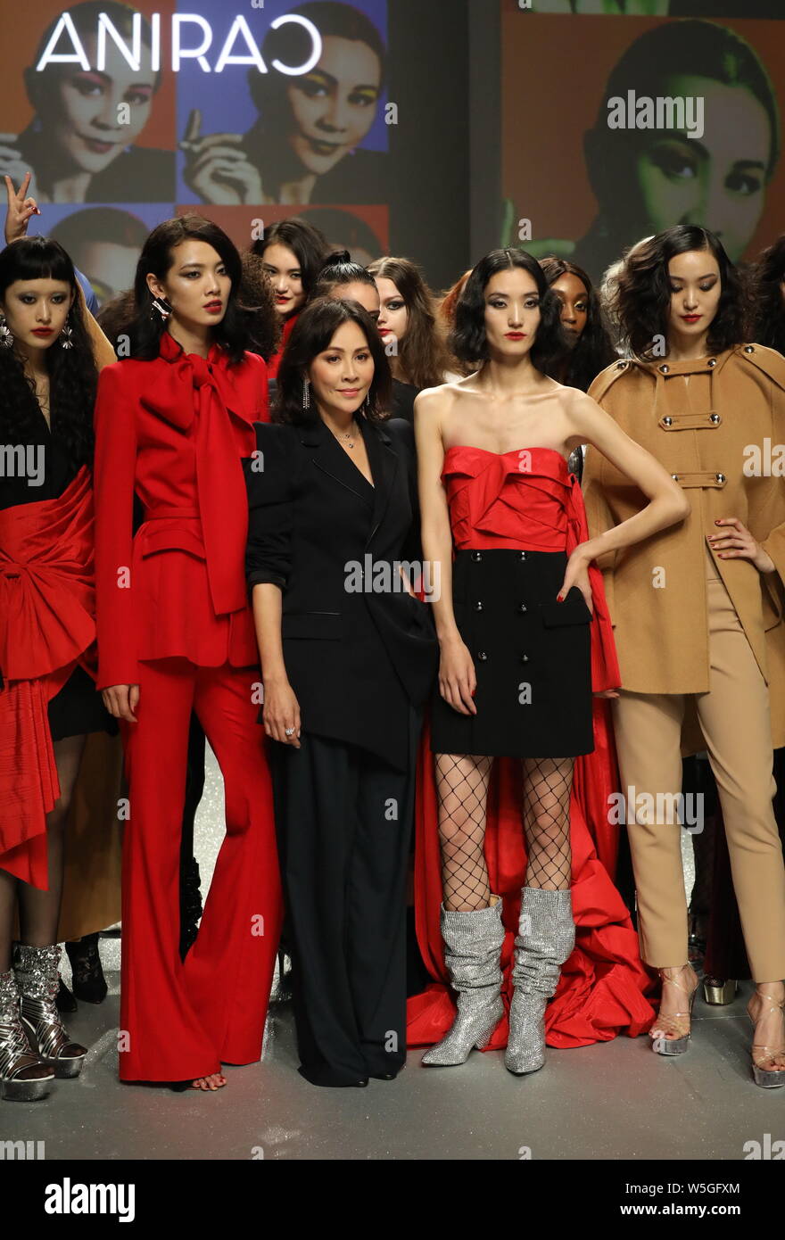 Hong Kong actress Carina Lau and models pose at the Anirac show during the Shanghai Fashion Week ...