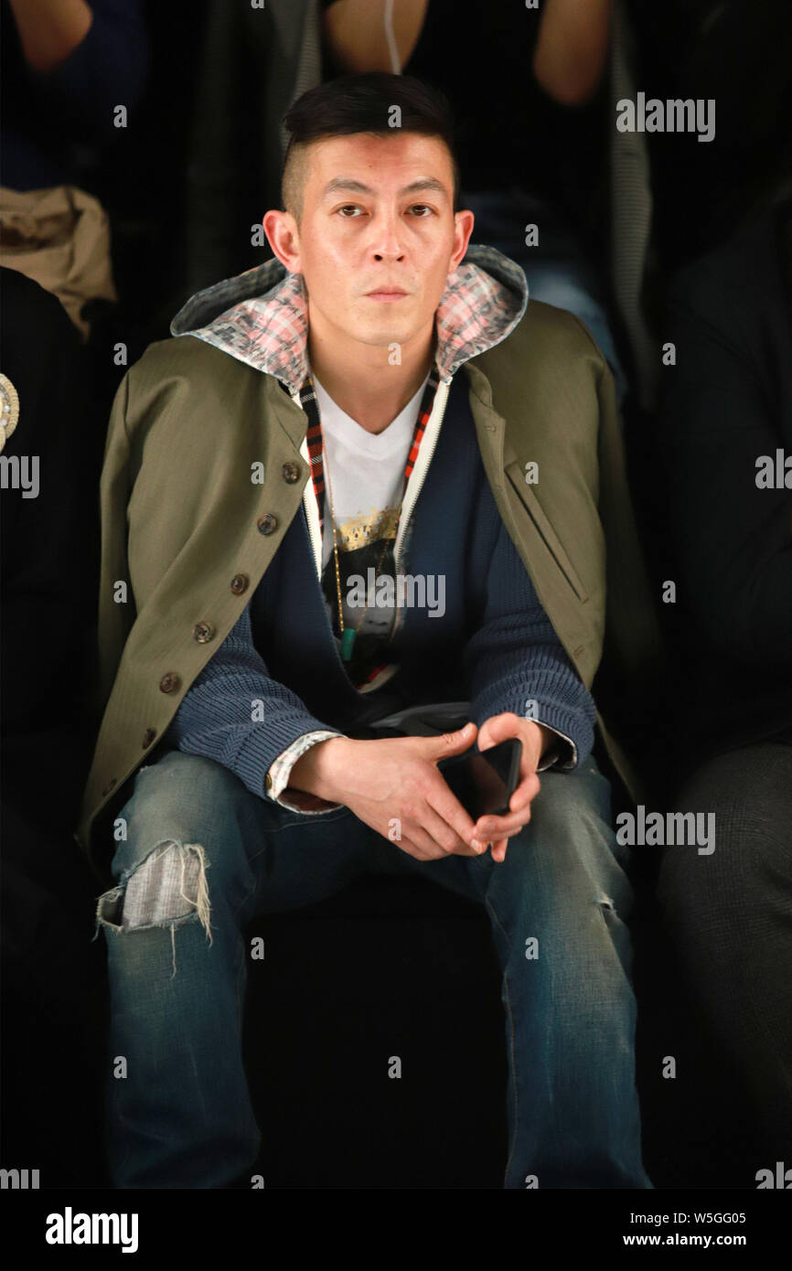 Hong Kong-Canadian actor and rapper Edison Chen watches models ...
