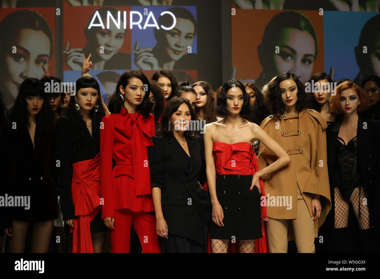 Hong Kong actress Carina Lau and models pose at the Anirac show during the Shanghai Fashion Week ...