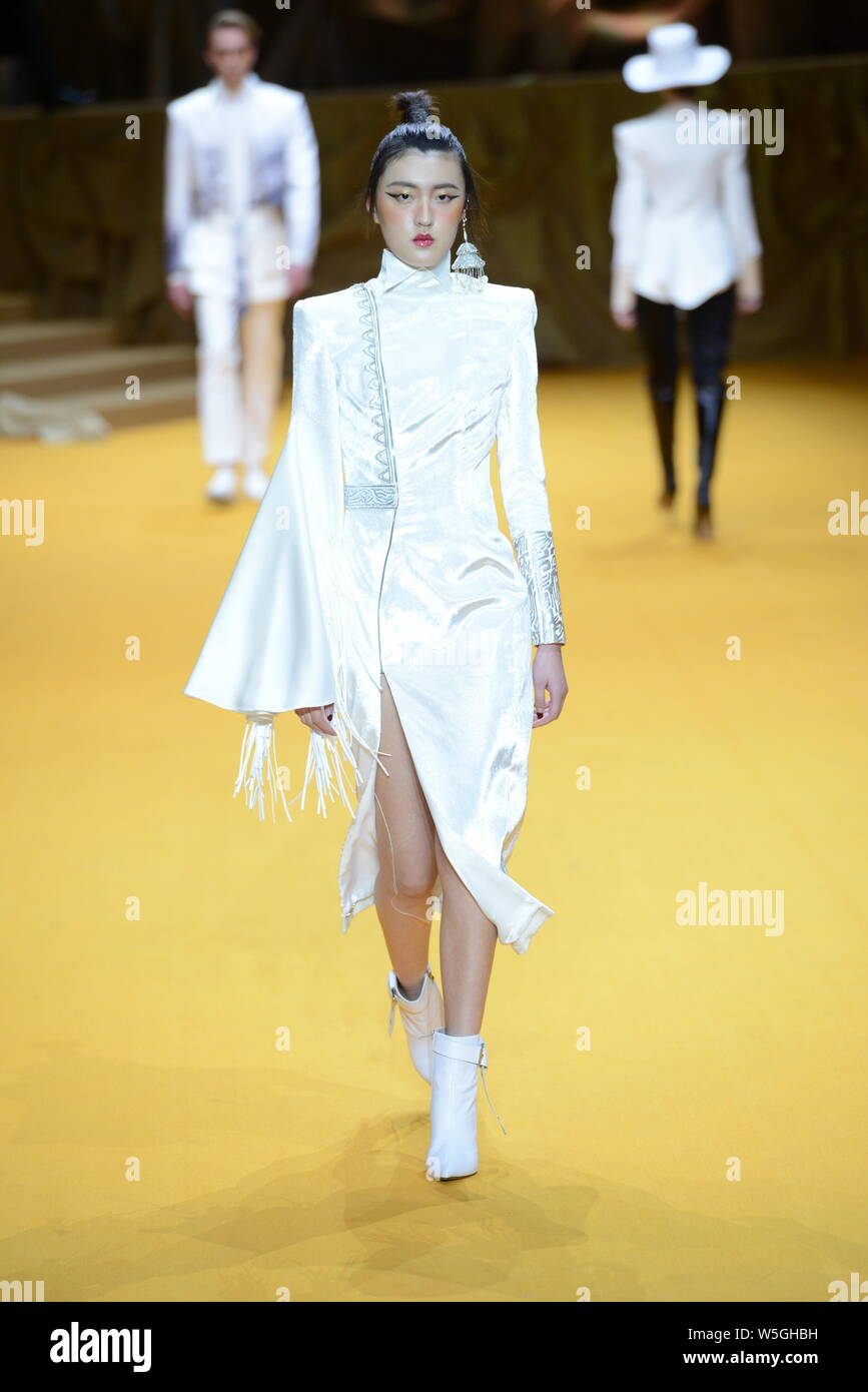A model displays a new creation at the fashion show of Maryma by Ma ...
