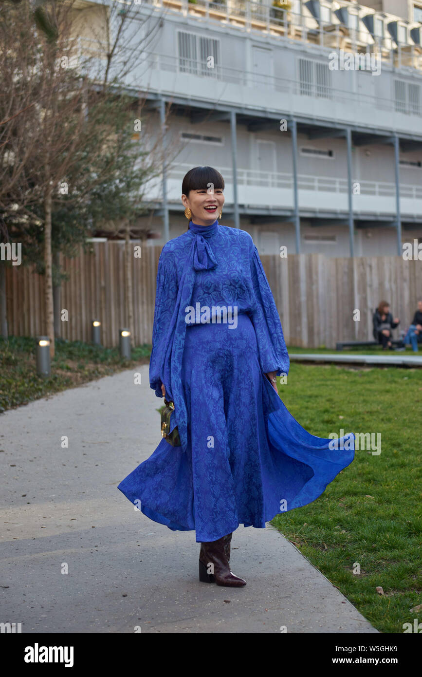 A trendy woman poses for street snaps during the Paris Fashion Week ...