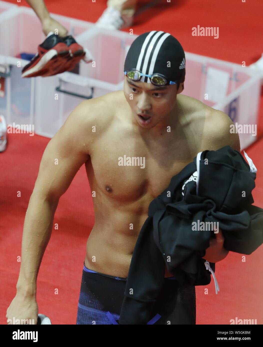 --FILE--Chinese world swimming champion Ning Zetao leaves after he ...