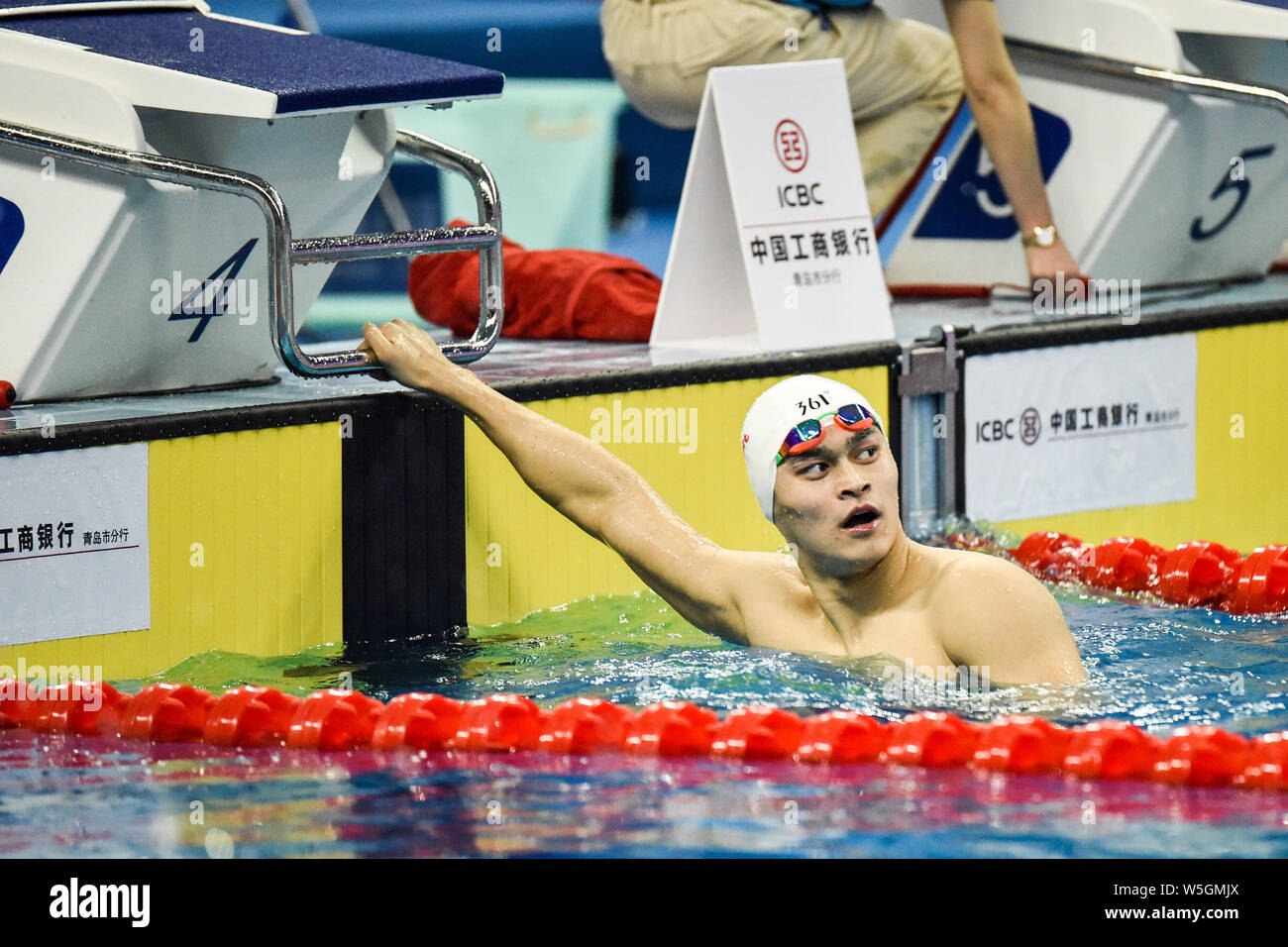 Chinese swimming Olympic champion Sun Yang reacts after winning the men ...