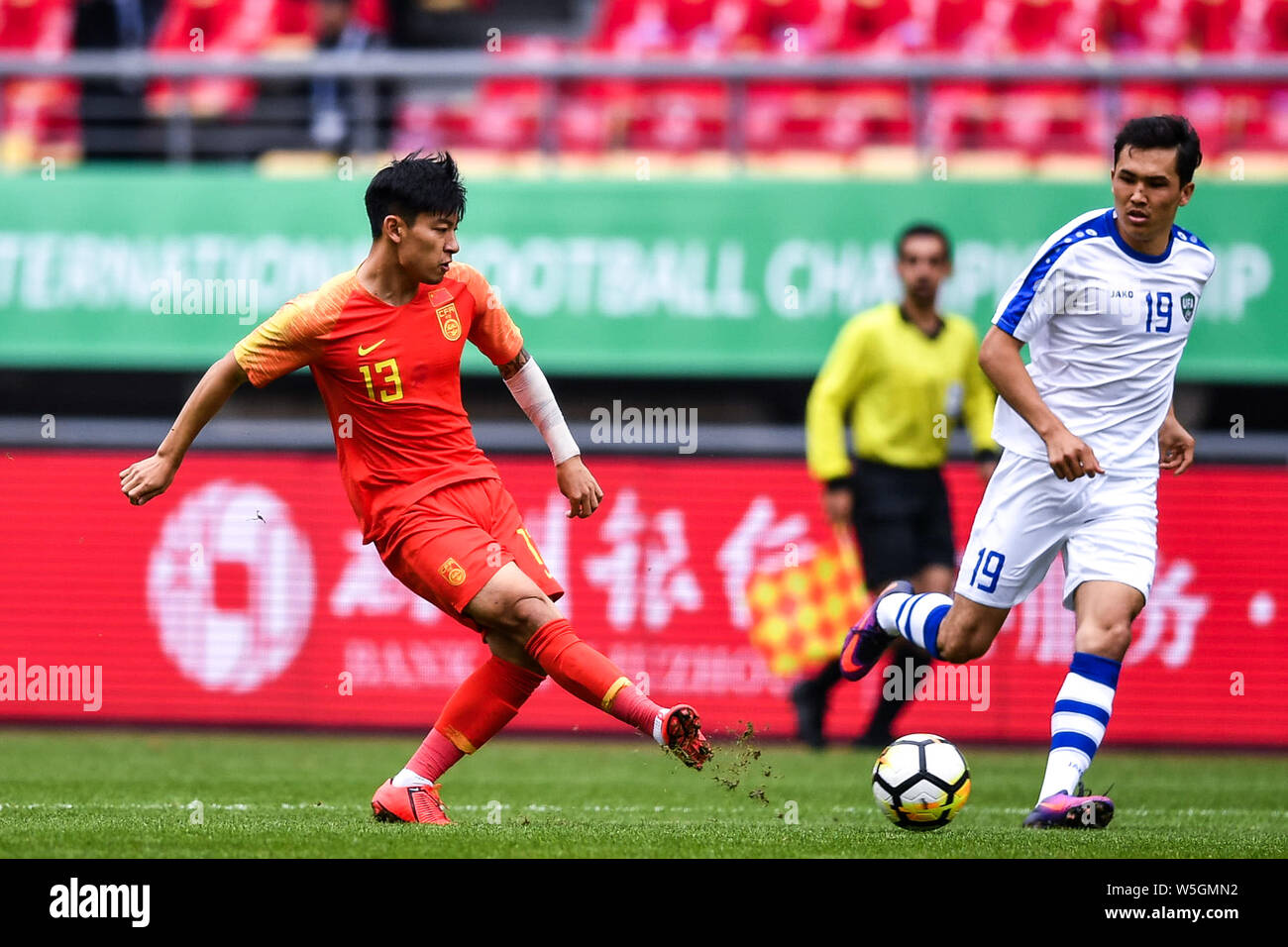 Otabek Shukurov, right, of Uzbekistan national football team challenges ...
