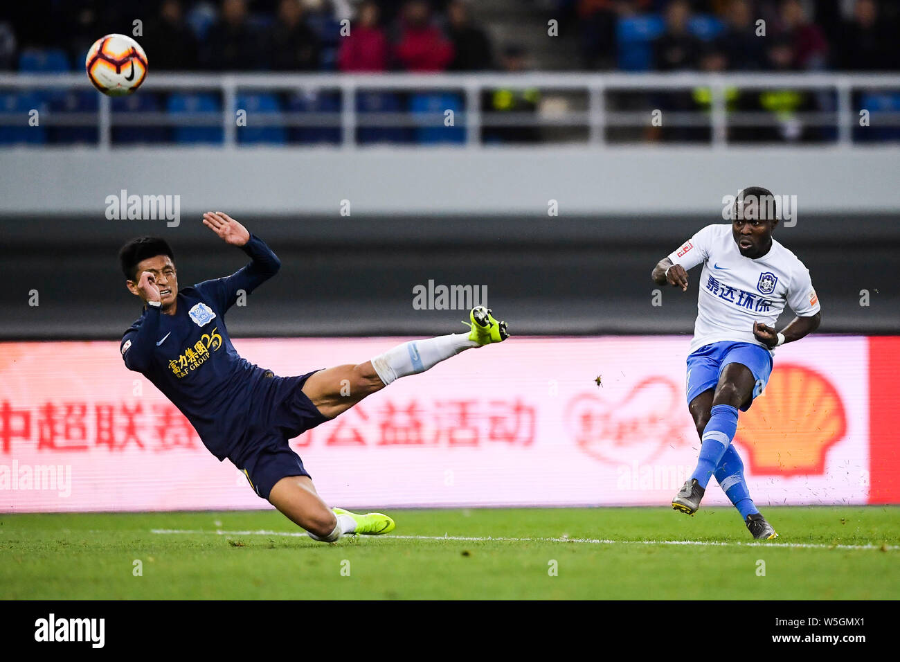 Ghanaian football player Frank Opoku Acheampong of Tianjin TEDA shots ...