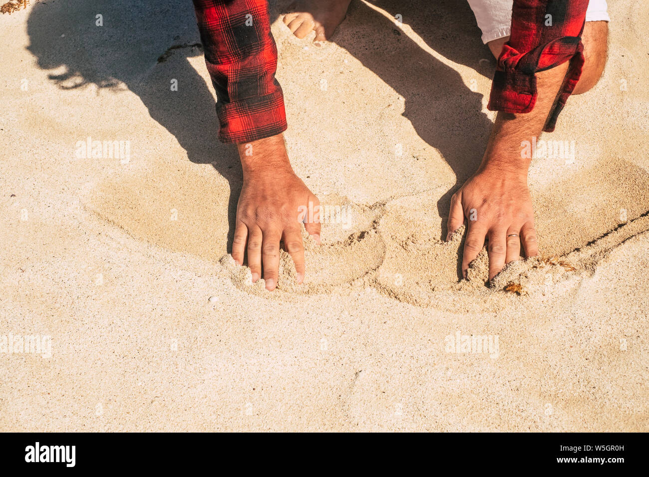 Hands touching the sand hi-res stock photography and images - Alamy