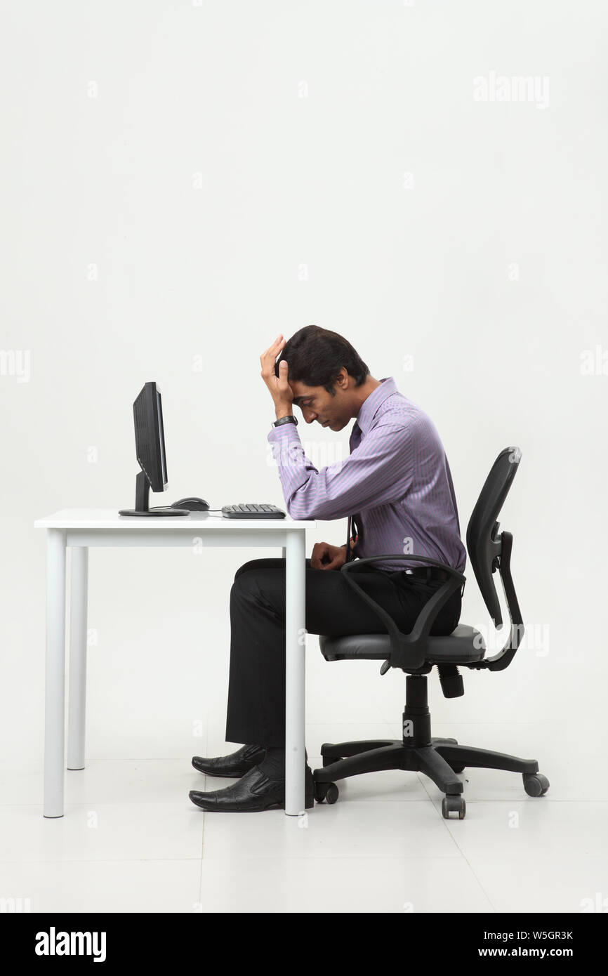 Businessman working on a desktop pc Stock Photo - Alamy