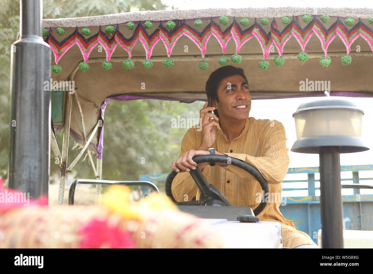 Driving tractor on phone hi-res stock photography and images - Alamy