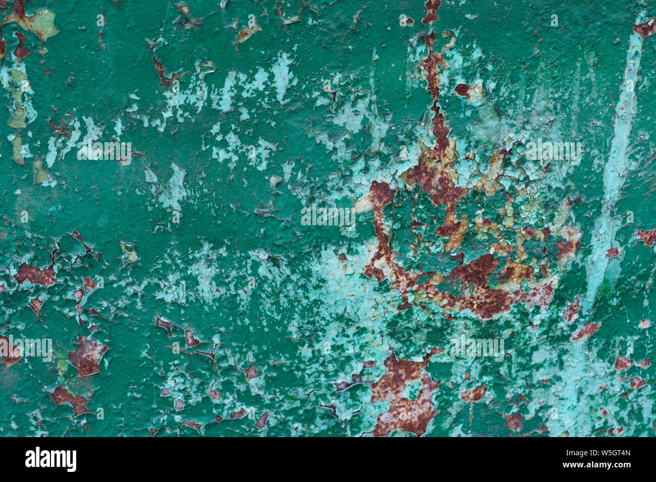 Cracked green and blue paint rusted metal background. Grunge texture ...