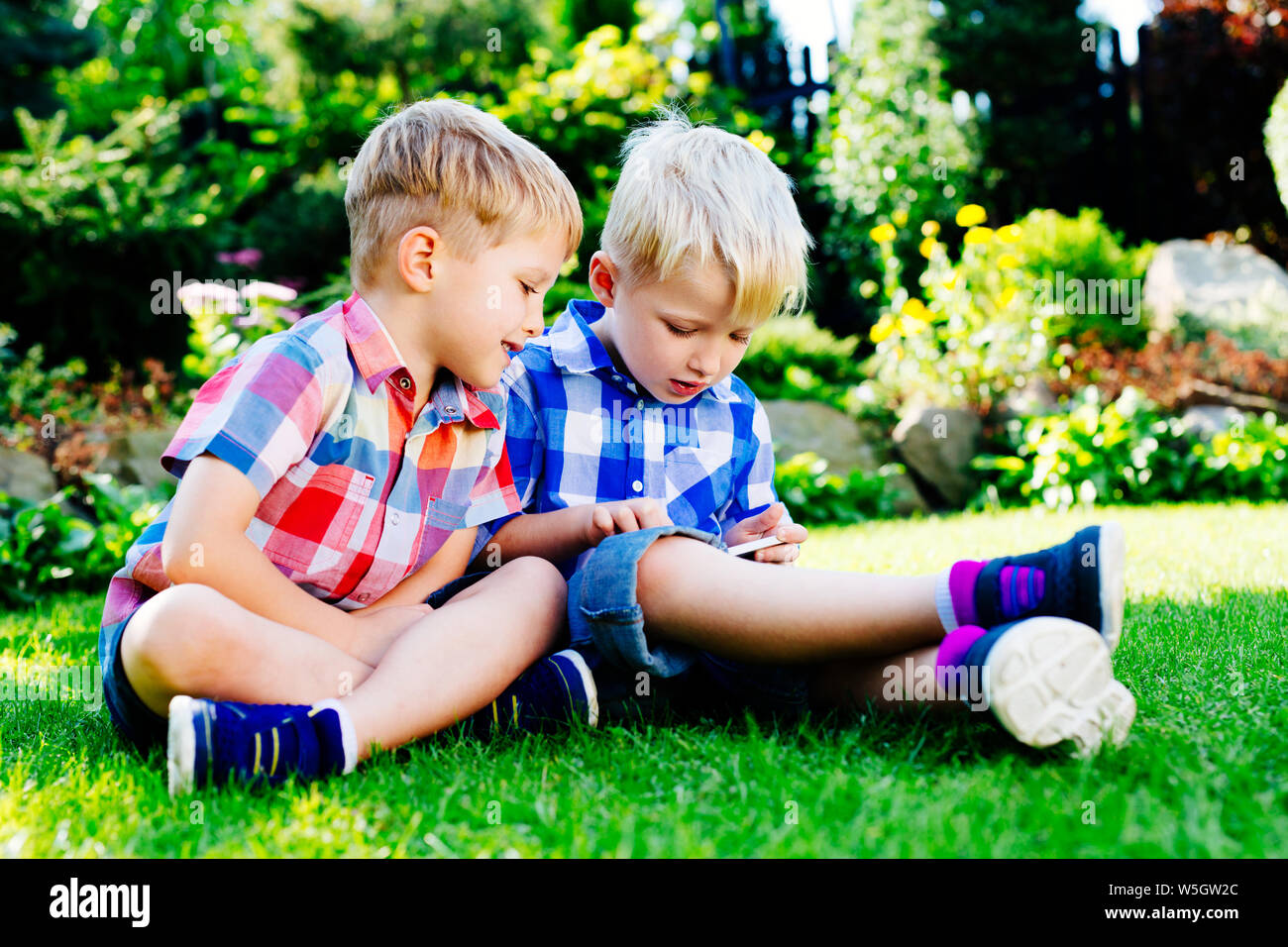 Boy boys male child children childhood kid kids playing hi-res stock ...
