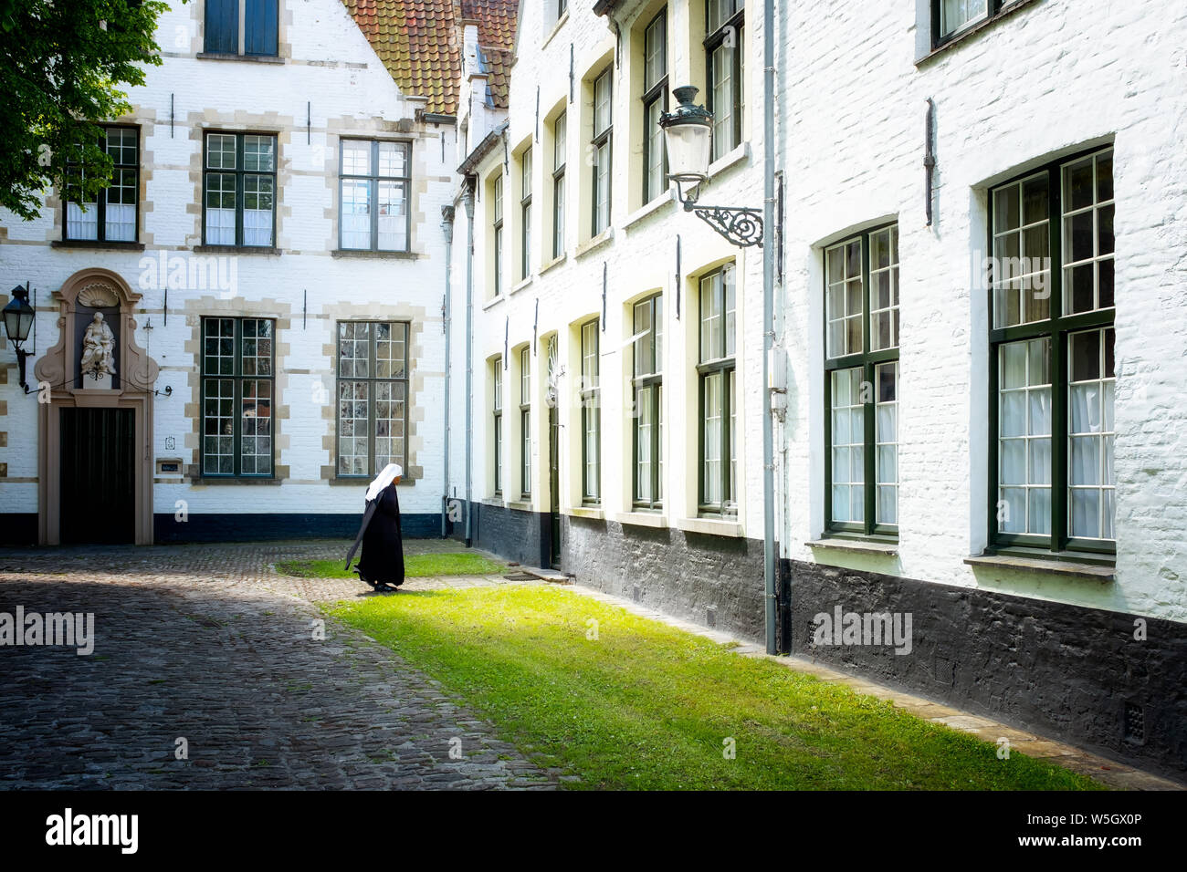 Nun at Begijnhof (Beguinage), Order of St. Benedict Convent, UNESCO ...