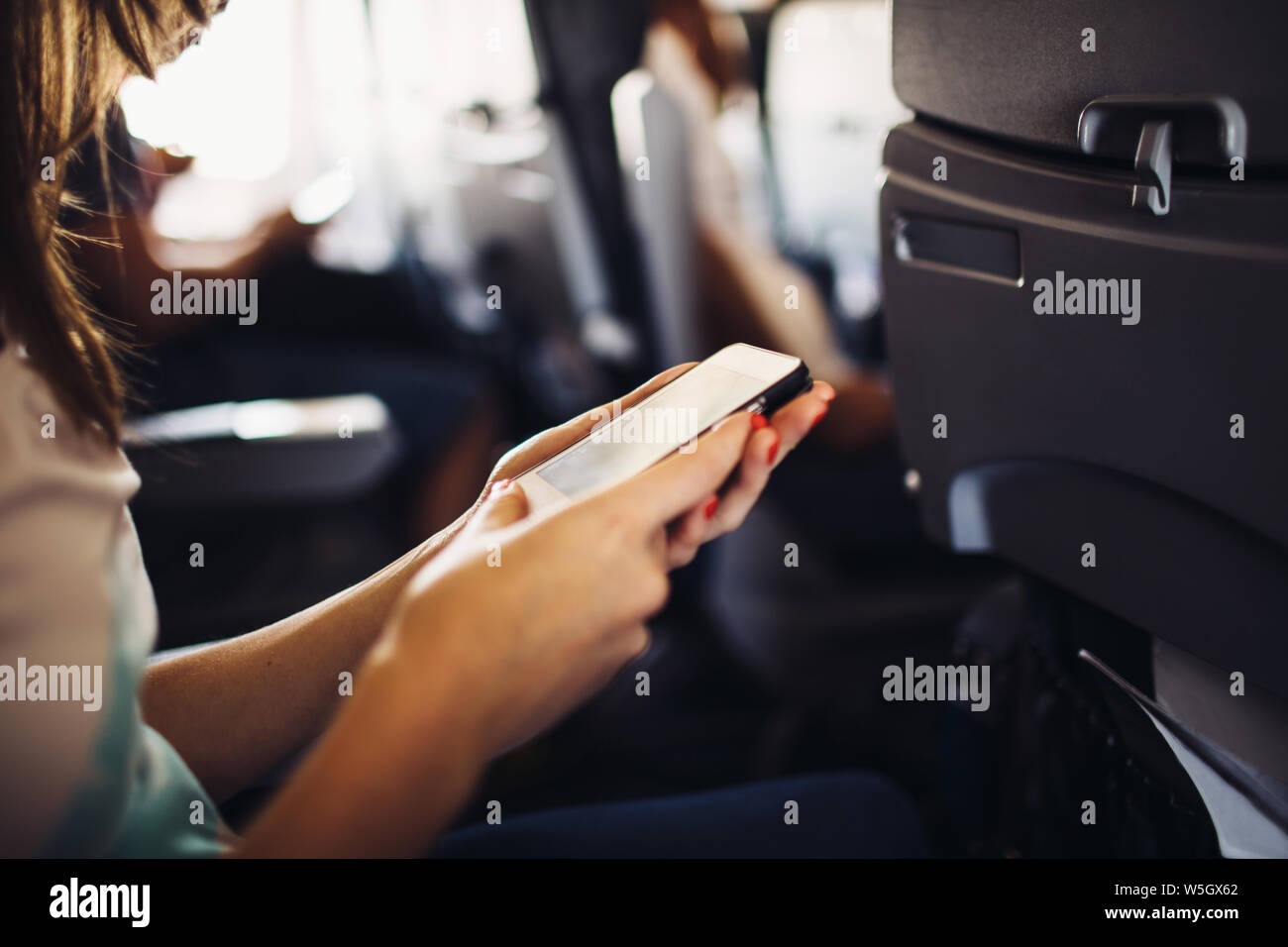 Unrecognizable female using smartphone close hi-res stock photography ...