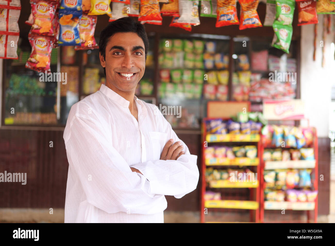 Indian shopkeeper smiling hi-res stock photography and images - Alamy
