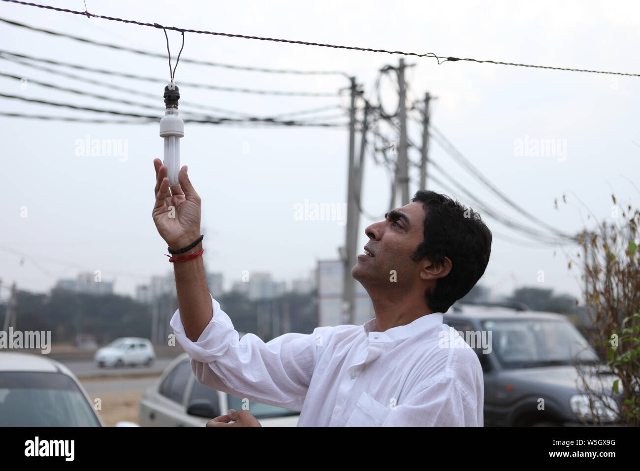 Electrician fixing light Stock Photo - Alamy