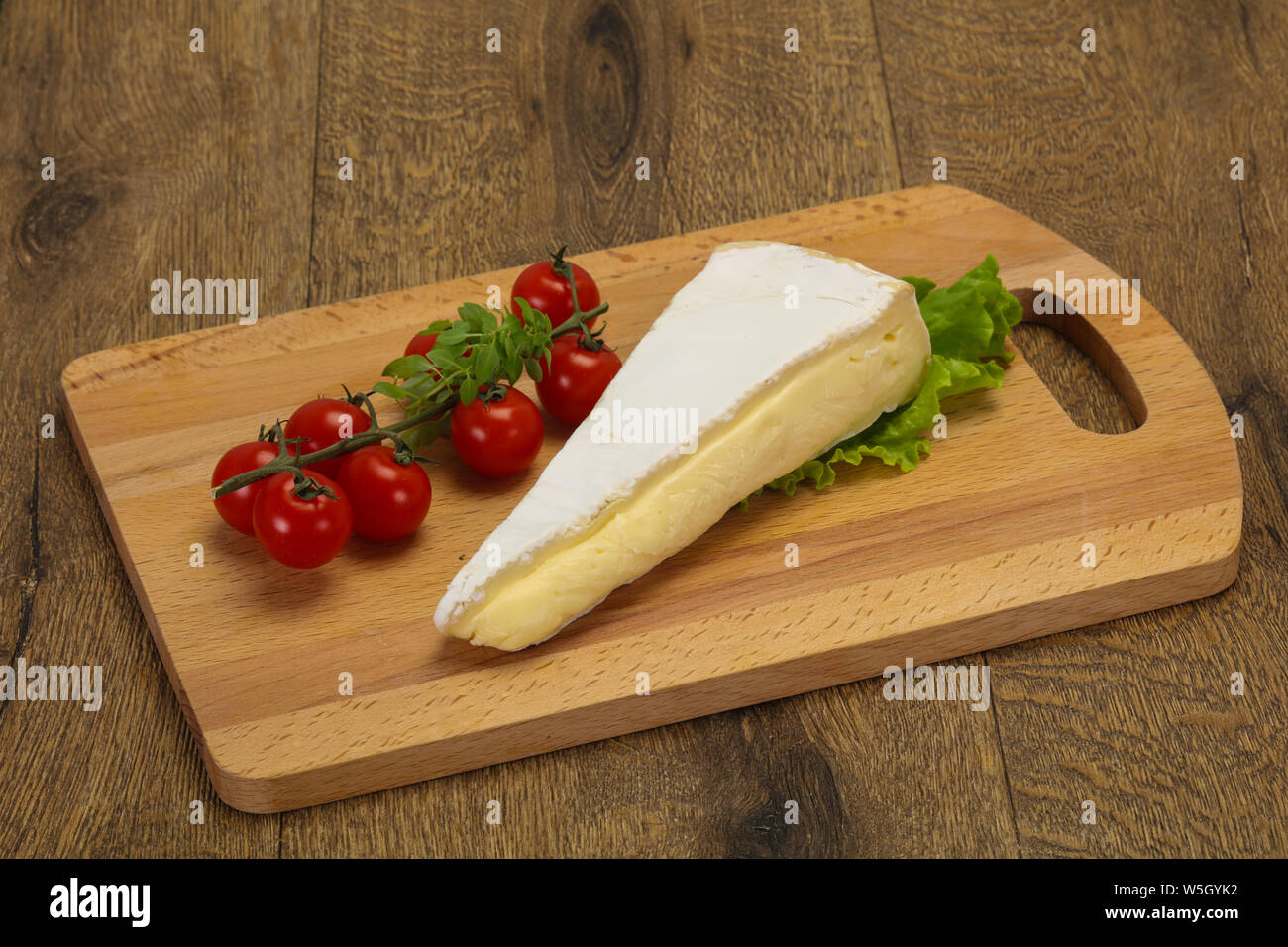 Brie cheese triangle served salad leaves Stock Photo - Alamy