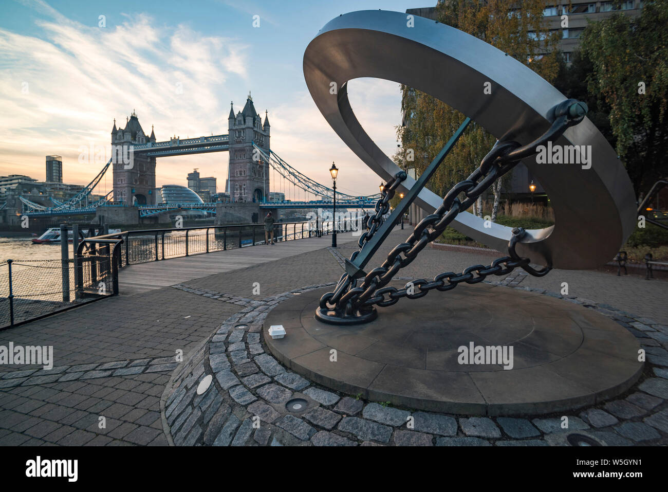 The Timepiece Sundial and Tower Bridge at sunset, St. Katharine's and ...