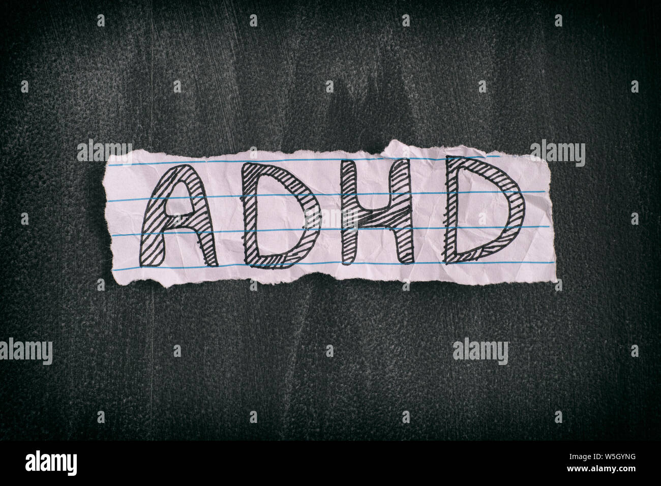 ADHD. Abbreviation ADHD on black background. Close up. ADHD is ...
