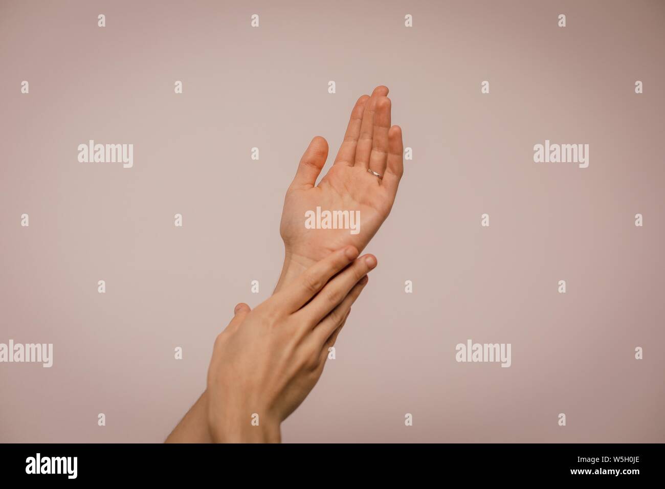 Emotional shot of two hands touching one another Stock Photo - Alamy