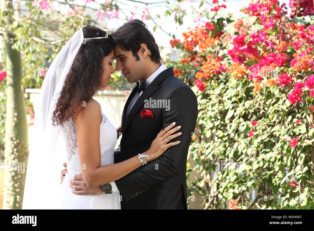 Newlywed couple romancing Stock Photo - Alamy