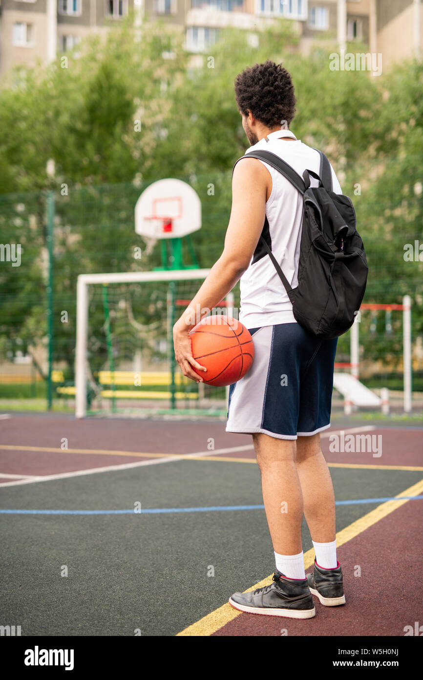 Young man on basketball playground hi-res stock photography and images ...