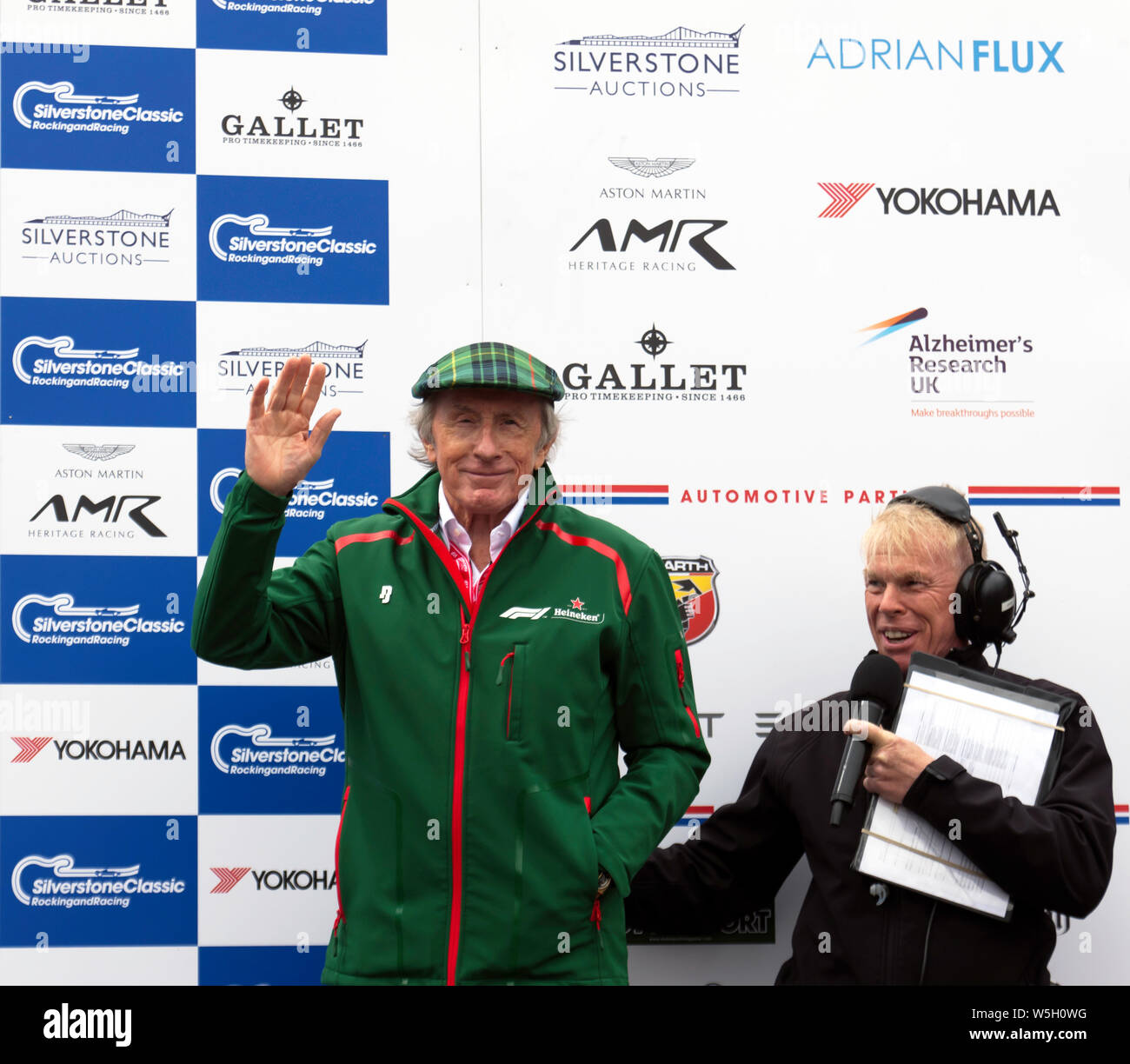 Sir Jackie Stewart waving to the crowd, before presenting the trophies ...