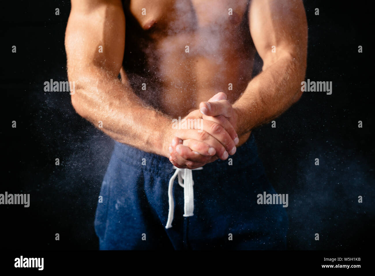 Close-up photo of a muscular torso and hands Stock Photo - Alamy