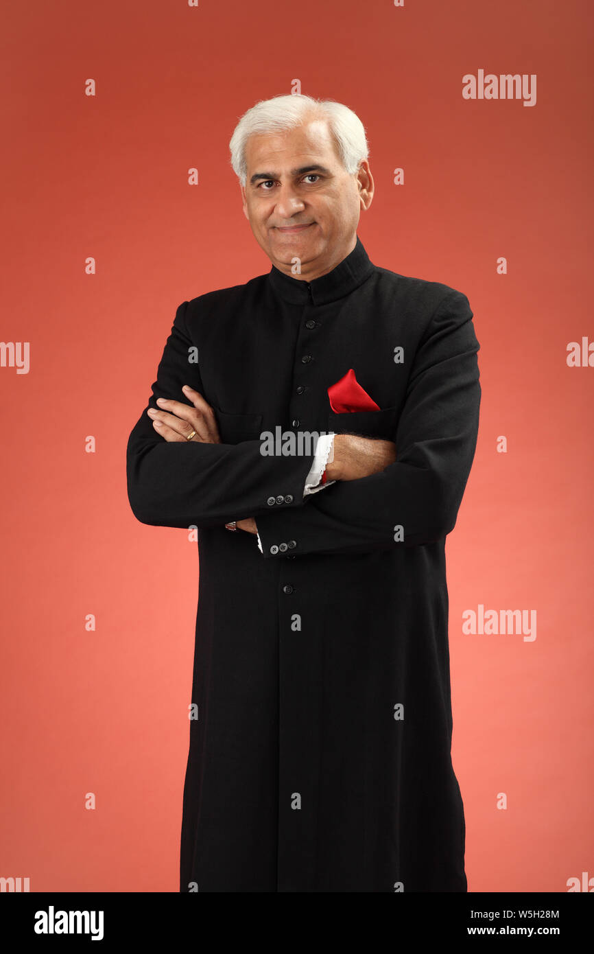 Old man standing with his arms crossed Stock Photo - Alamy