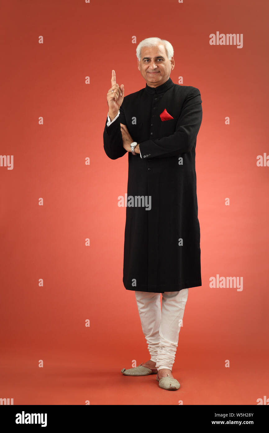 Old man standing and pointing upward Stock Photo - Alamy