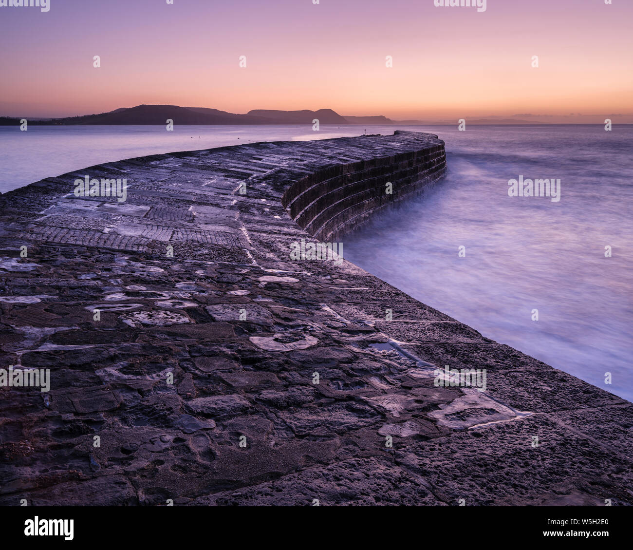 The harbour wall known as The Cobb in Lyme Regis, Dorset, England ...