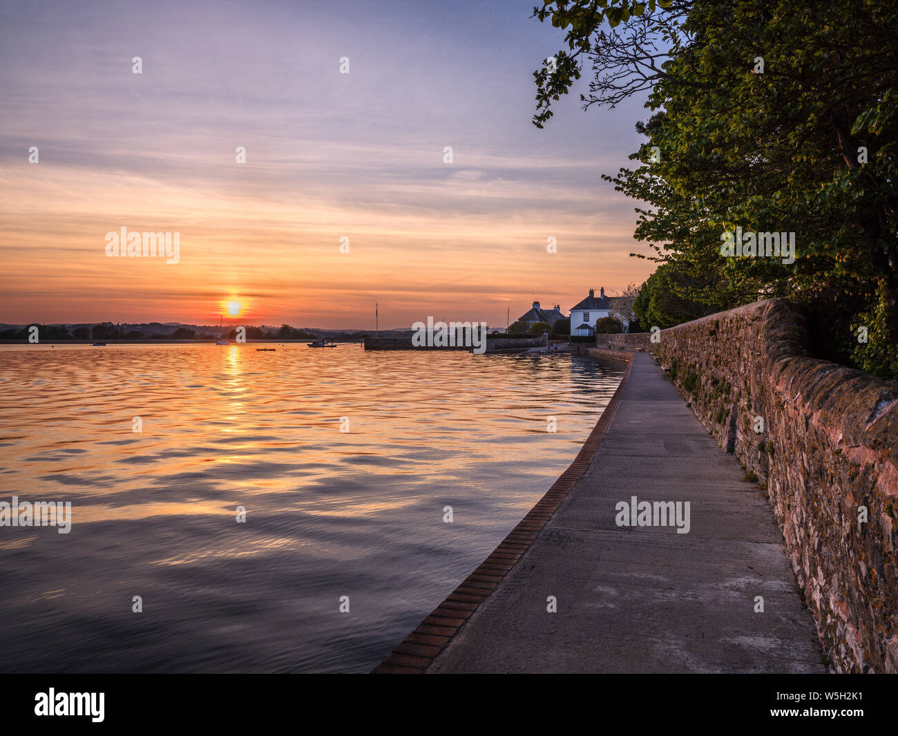 High tide sunset on The Goat Walk with a mirror calm River Exe at ...