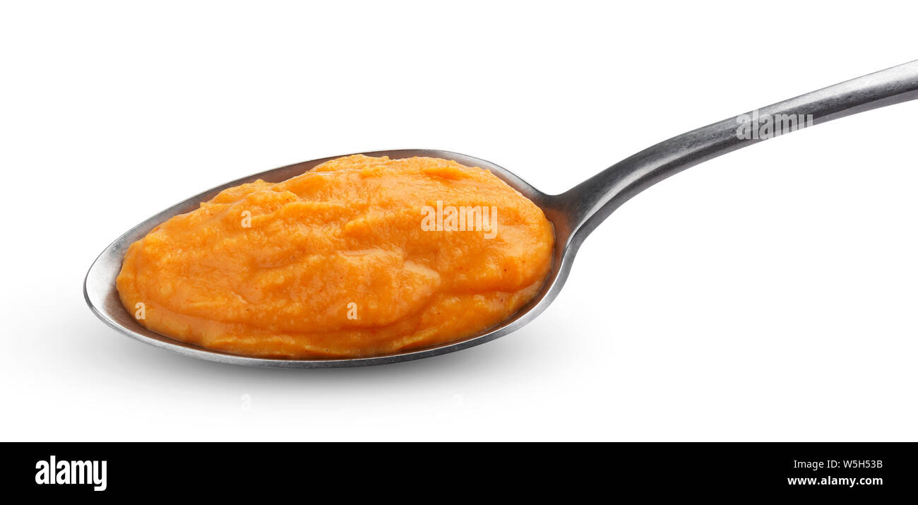 Pumpkin and carrot baby puree in spoon isolated on white background ...