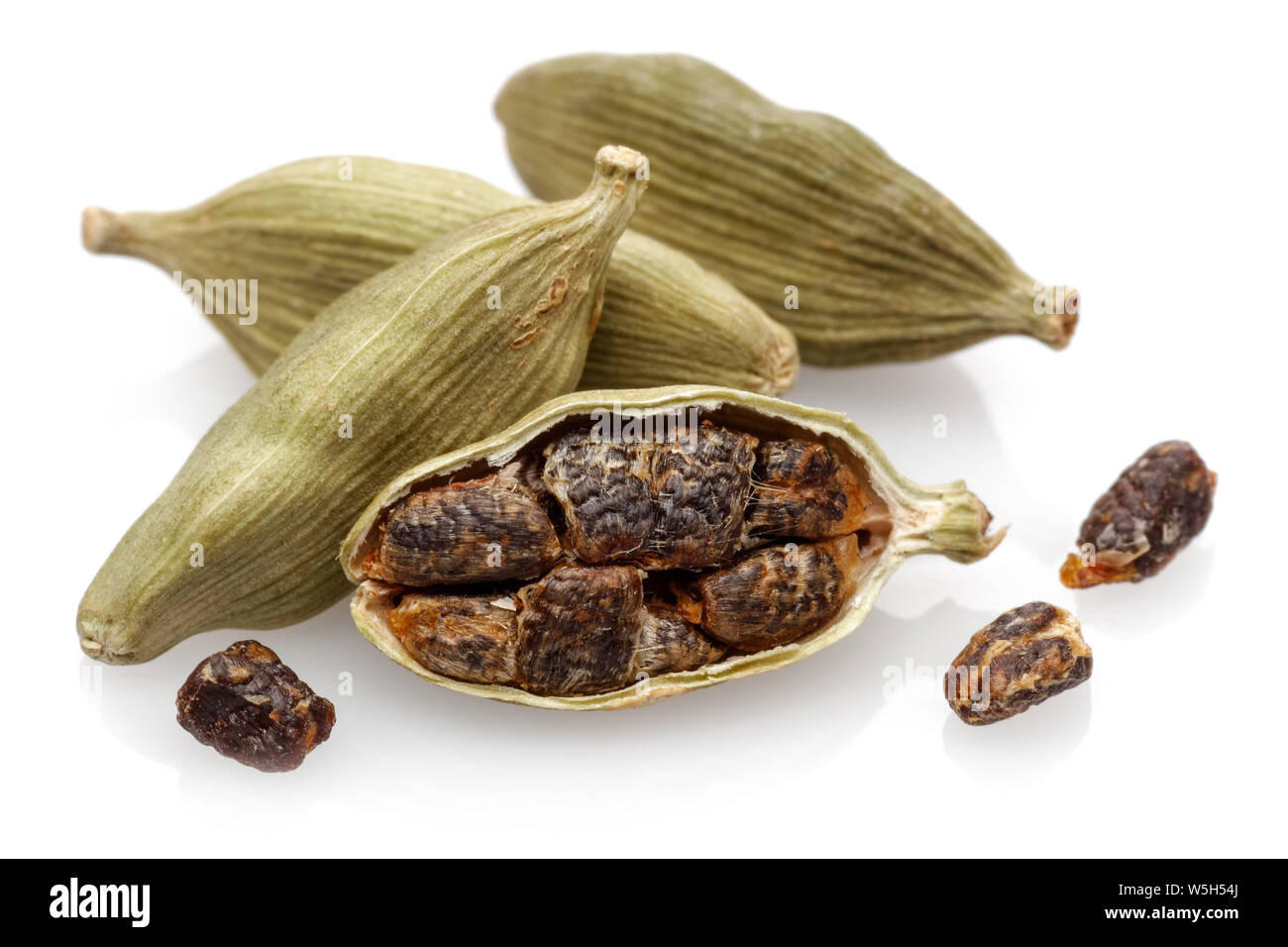 Cardamom pods and seeds isolated on white background Stock Photo - Alamy
