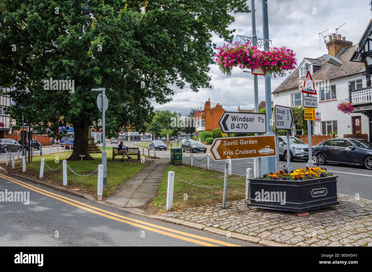 Road signs in the Berkshire village of Datchet on a road island ...