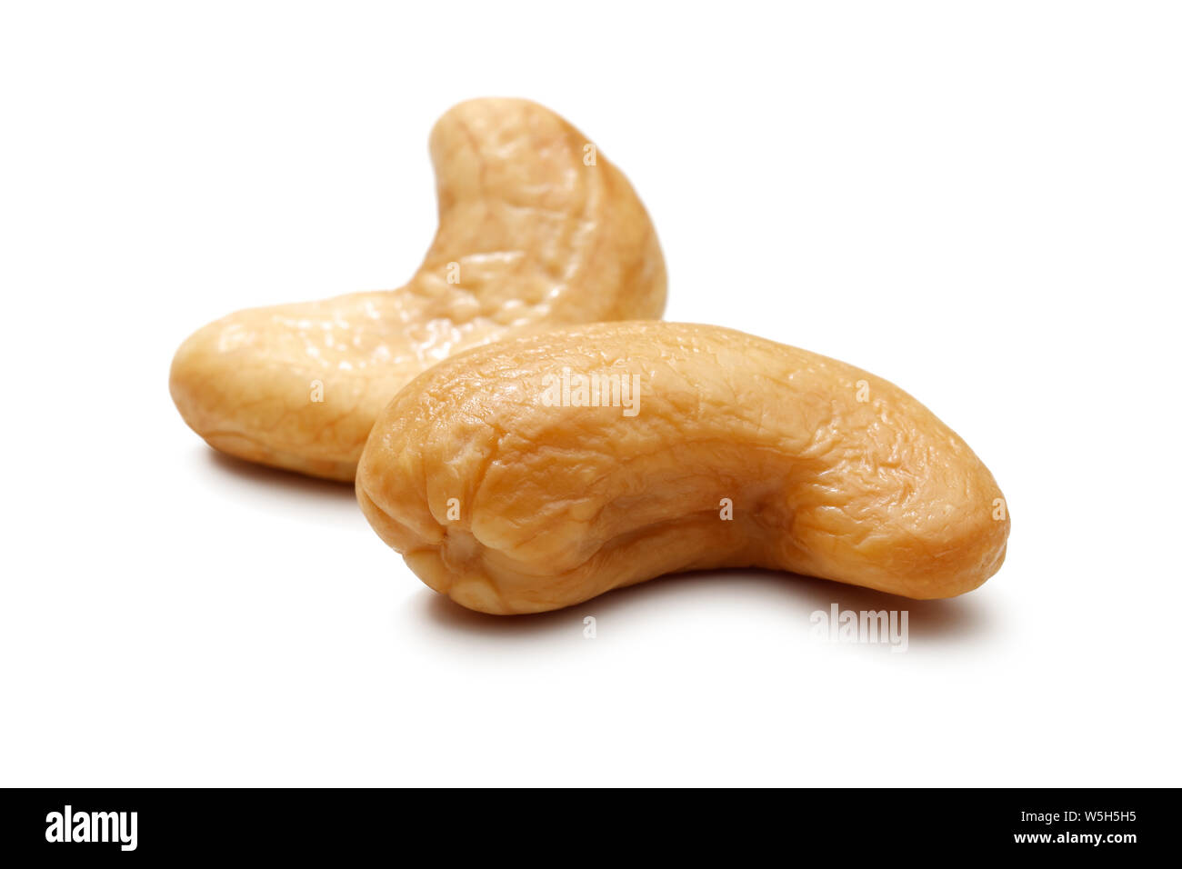 Roasted cashew nuts isolated on white background Stock Photo - Alamy
