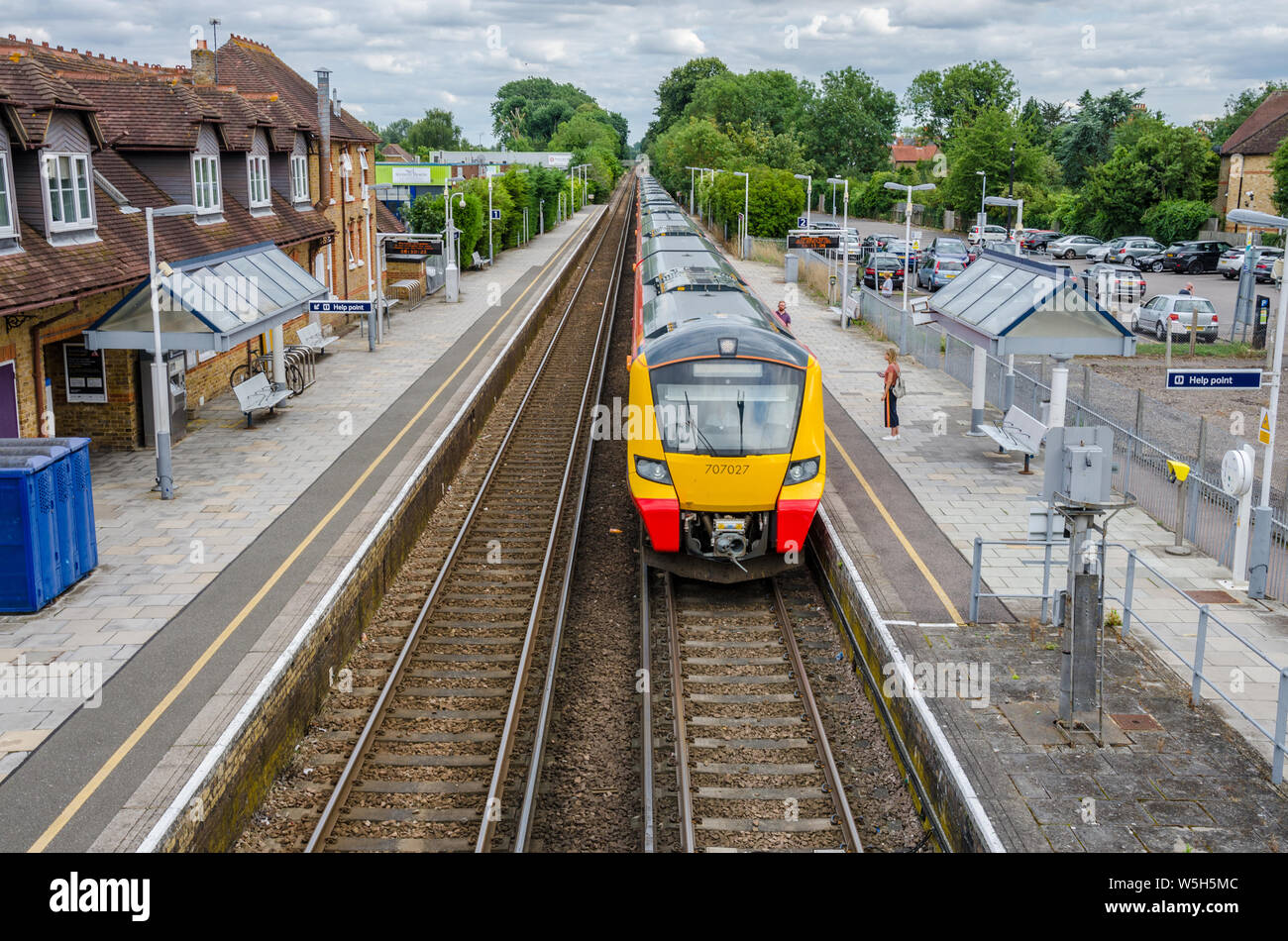 A train sits in Datchet Railway Station where a handful of passengers ...