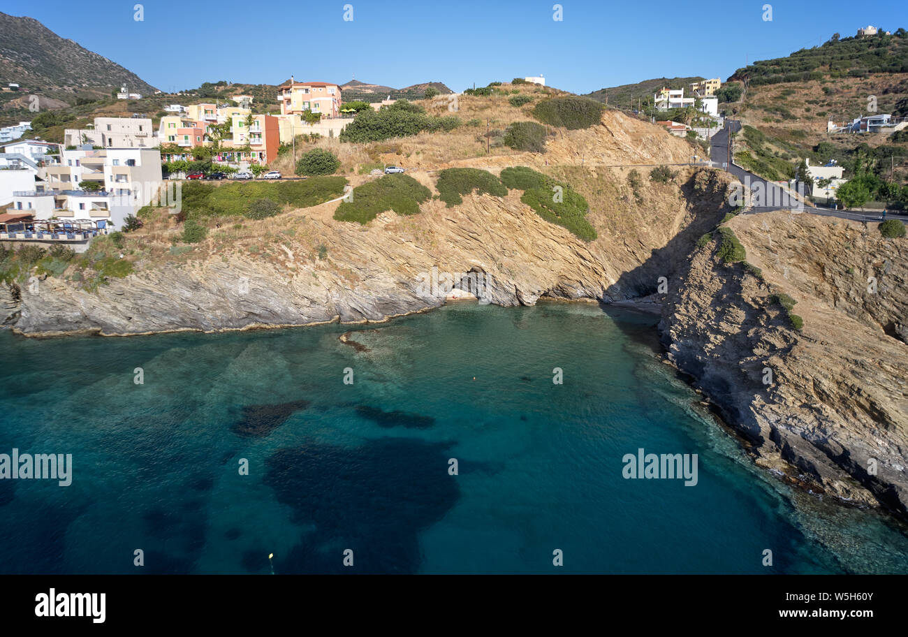Aerial view of resort village Bali and small two cave beach. Crete ...