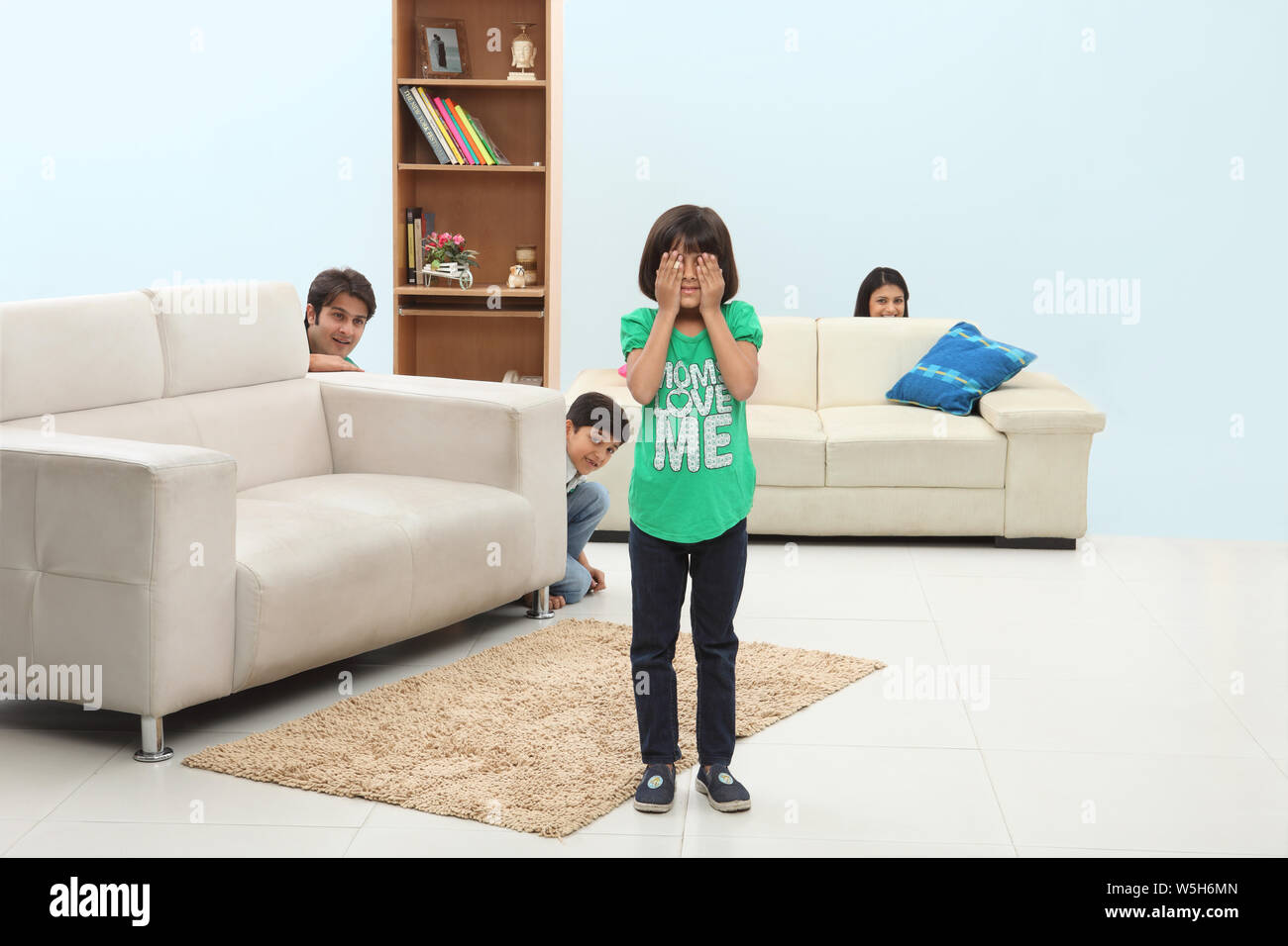 Boy covering eyes playing hide hi-res stock photography and images - Alamy