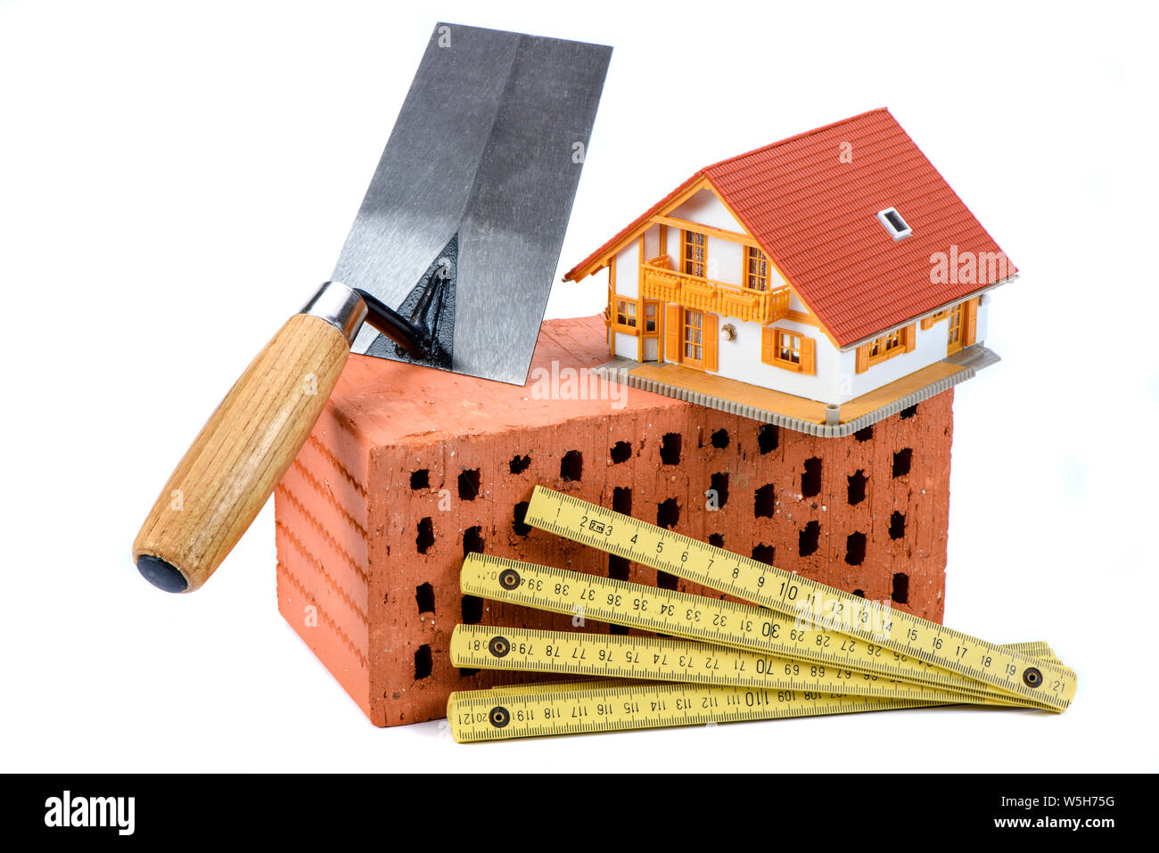 brick and model home for house construction Stock Photo - Alamy