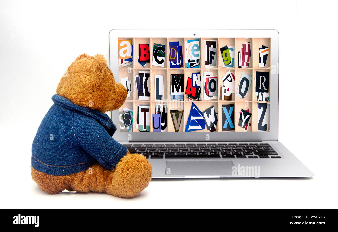 teddy learns the alphabet on a laptop computer Stock Photo - Alamy