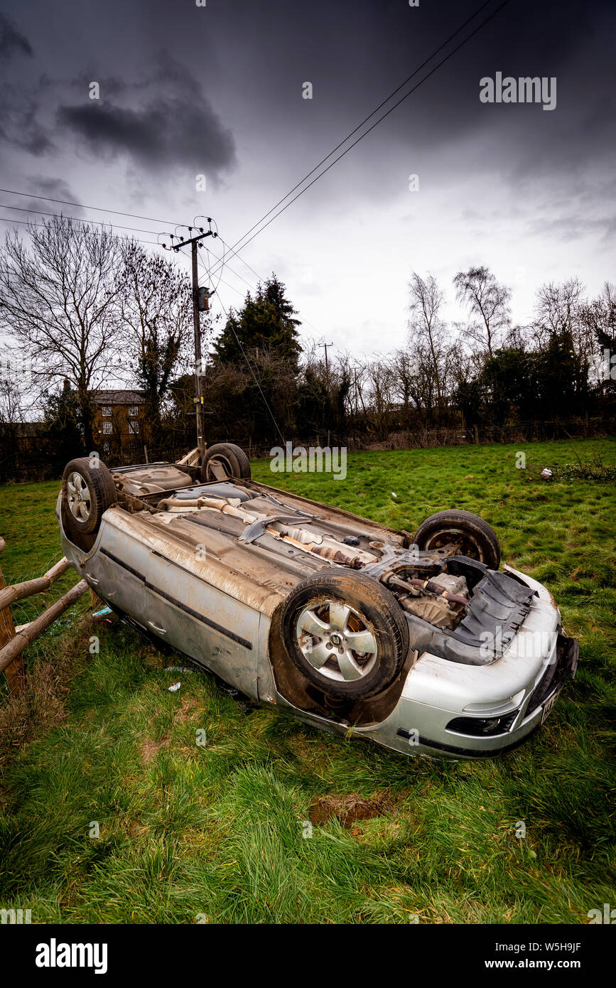 Car crash. Young drivers overturned vehicle. Non fatal accident caused ...