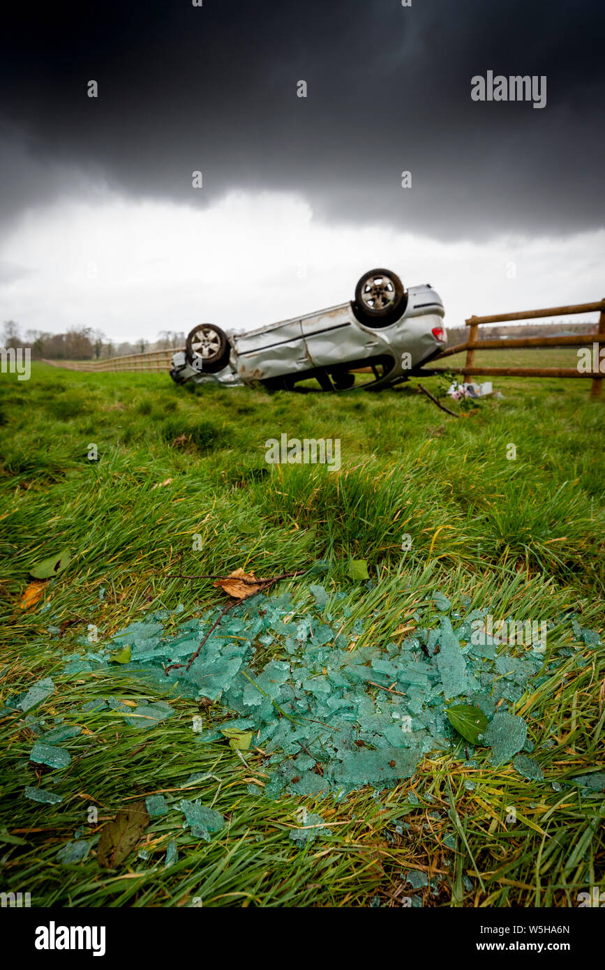 Car crash. Young drivers overturned vehicle. Non fatal accident caused ...