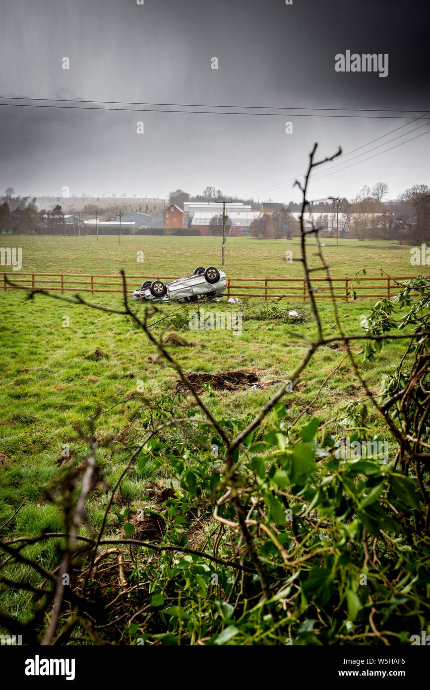 Car crash. Young drivers overturned vehicle. Non fatal accident caused ...