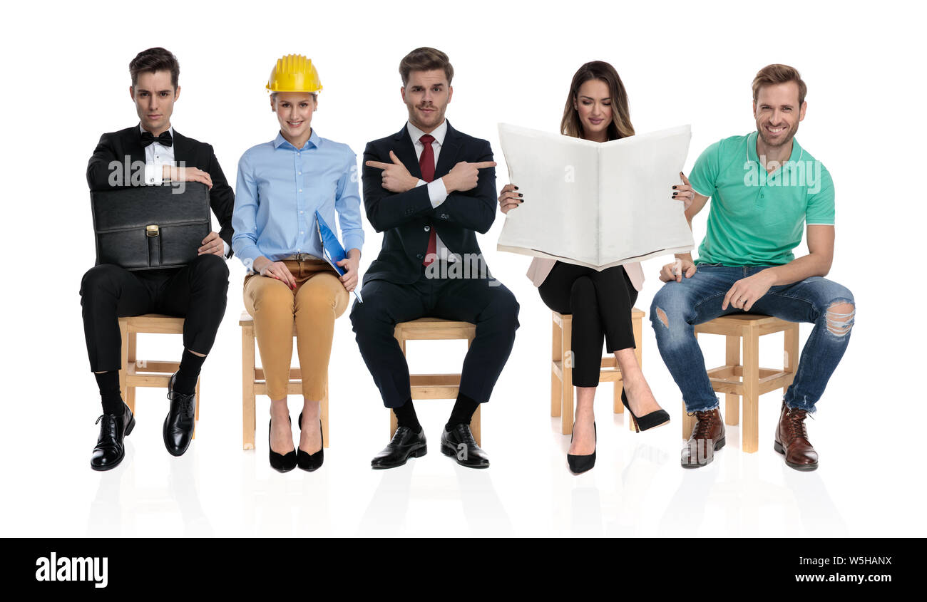 group of five different people waiting for a job interview, sitting on ...