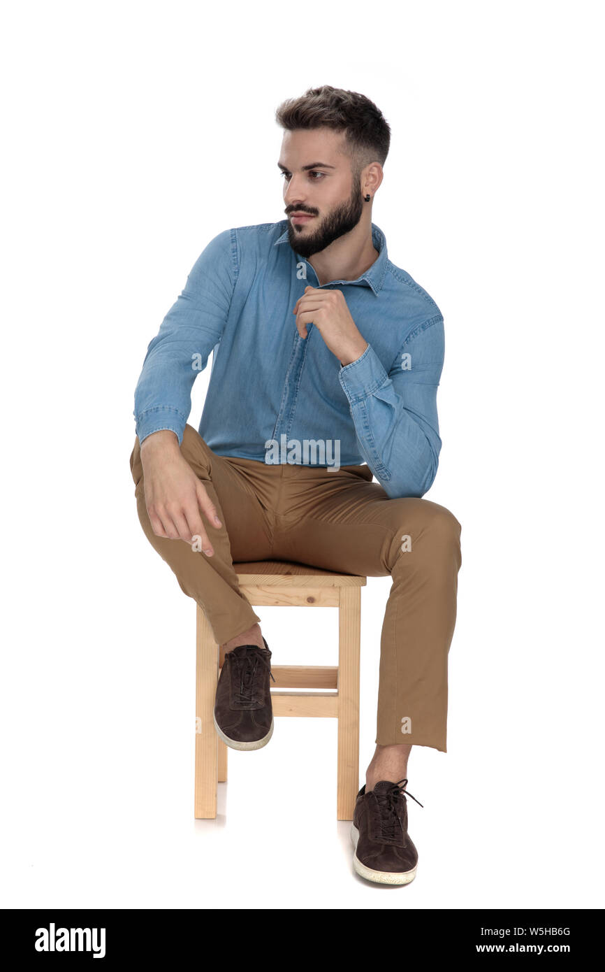 Elbow rest on knee hi-res stock photography and images - Alamy